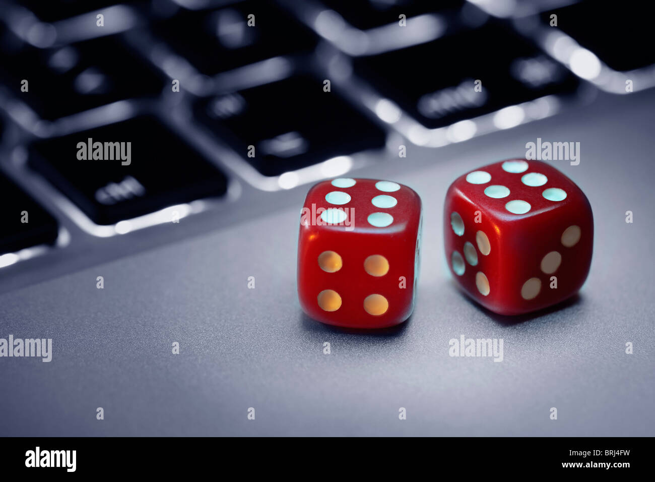 Dice on computer keyboard Stock Photo - Alamy