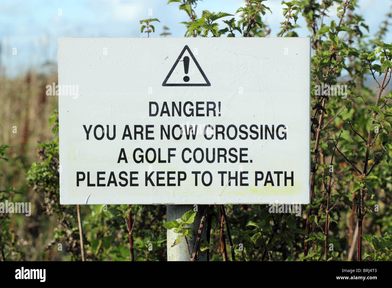 Danger crossing golf course sign Stock Photo - Alamy