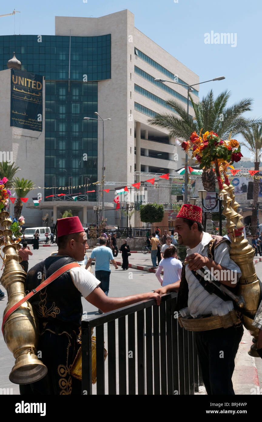 Palestinian Authority. City of Nablus. street scene with new municipal shopping mall in bkg ...