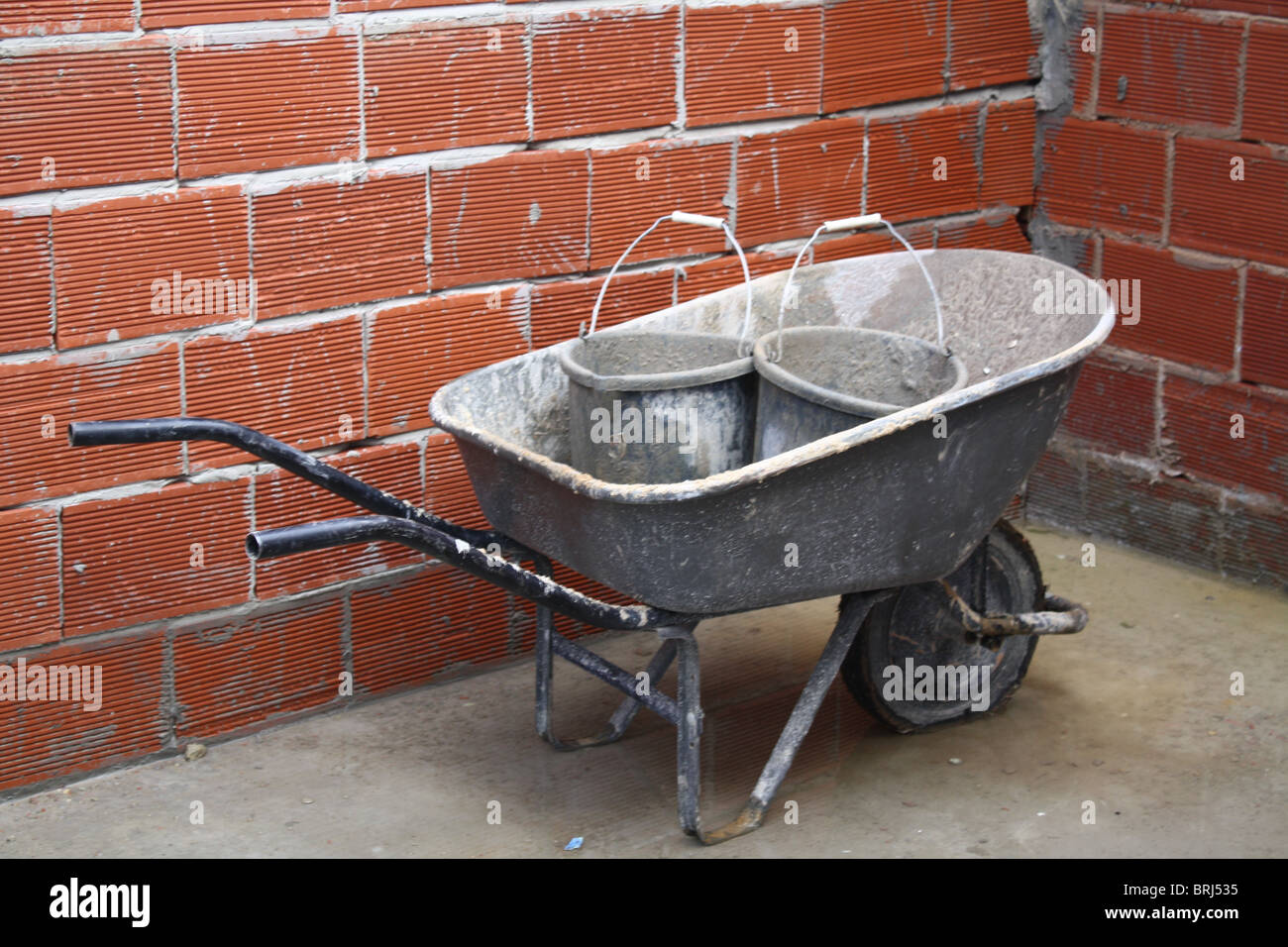 Wheel Barrow And Buckets Stock Photo - Alamy
