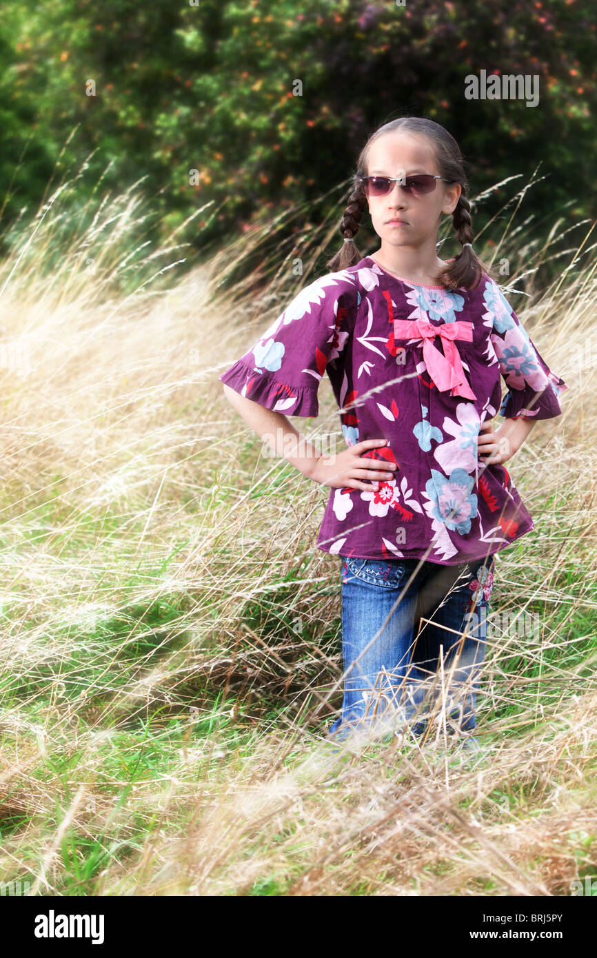Child posing in meadow Stock Photo - Alamy