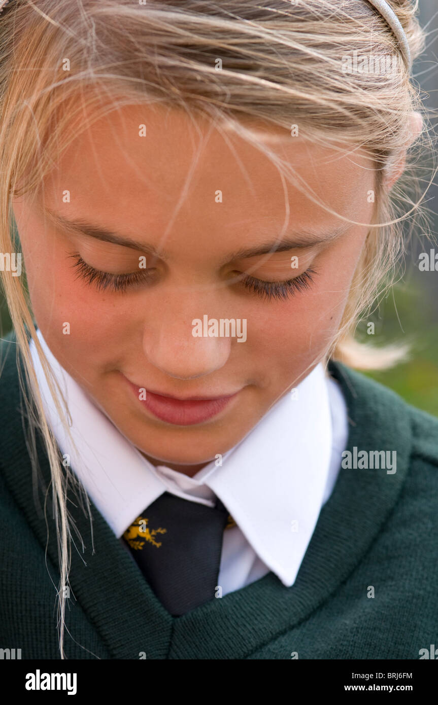 Schoolgirl with head looking down Stock Photo - Alamy
