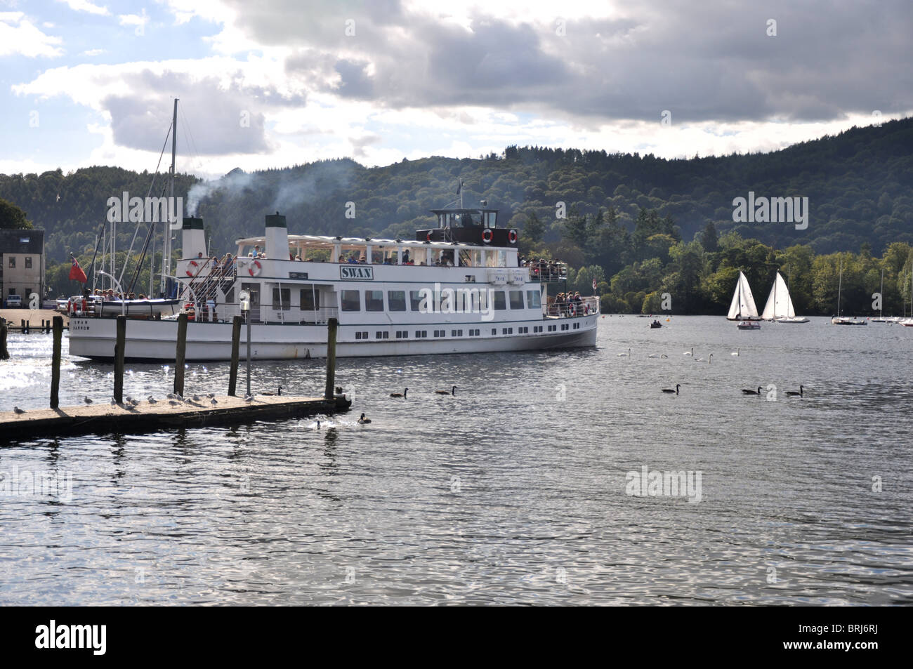 THE SWAN BOAT COMING IN TO DOCK AT BOWNESS ON WINDERMERE Stock Photo ...