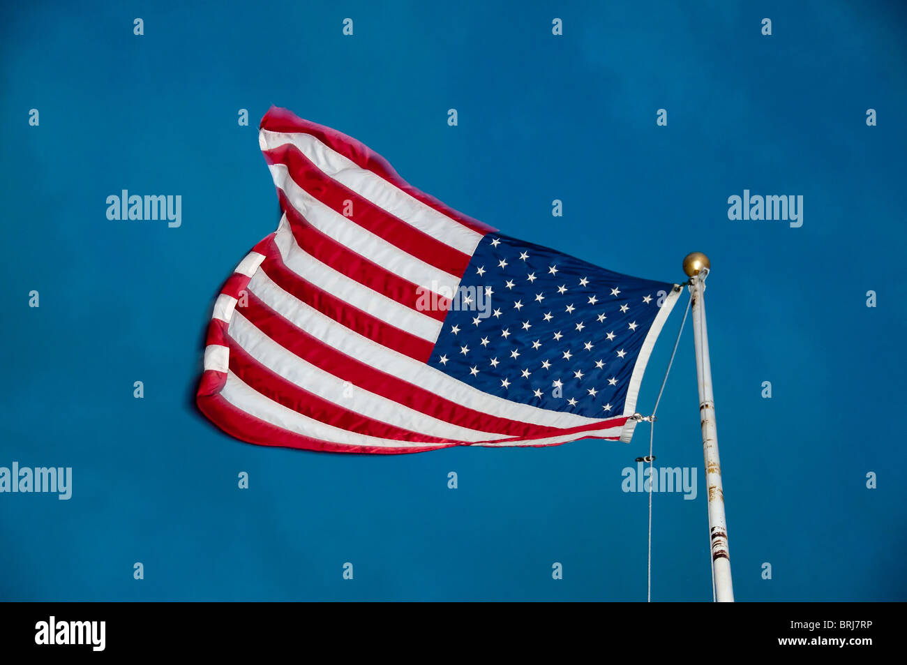 American flag blowing in the wind Stock Photo - Alamy