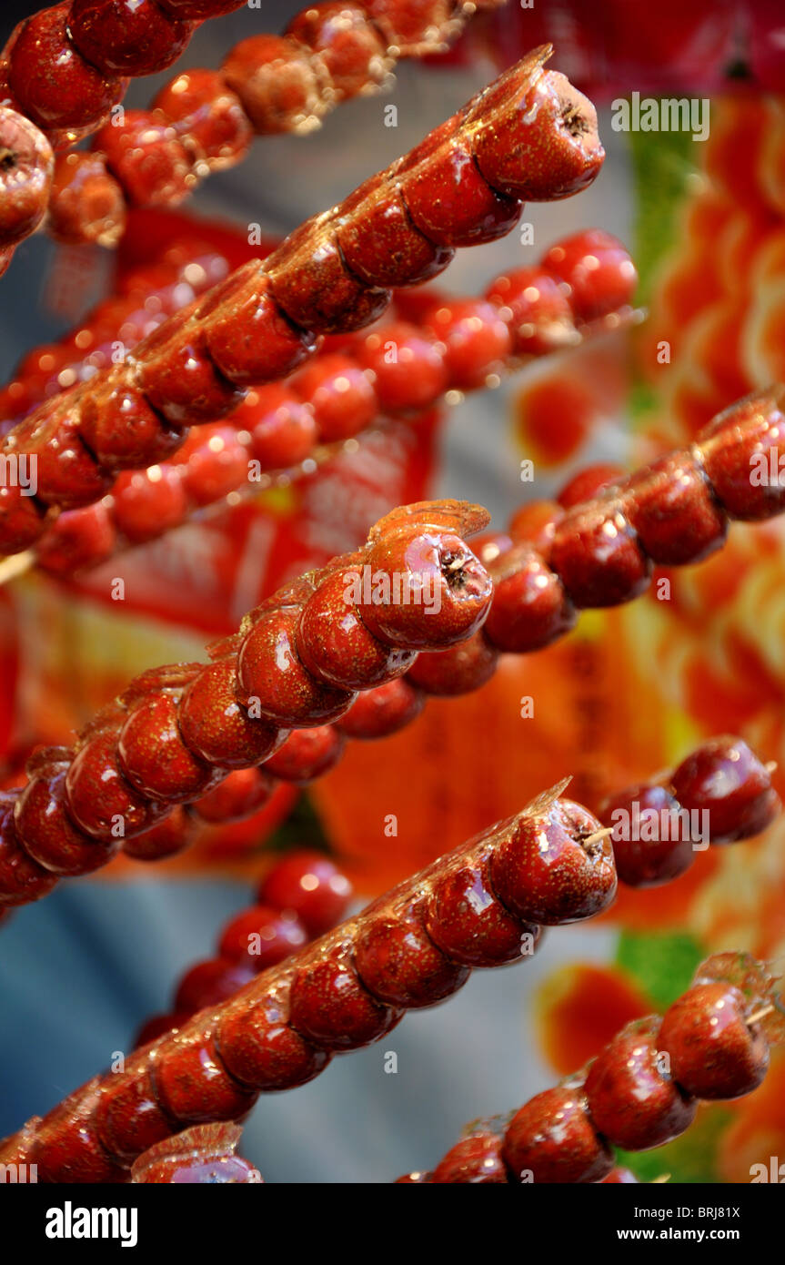 Candied Strawberries on a stick at food market in Beijing in China ...