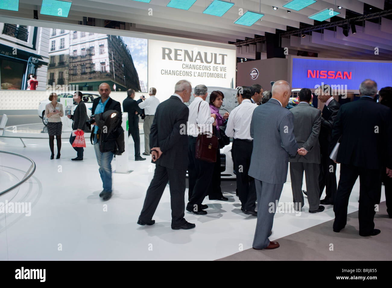 Businessmen visiting paris auto show hi-res stock photography and ...