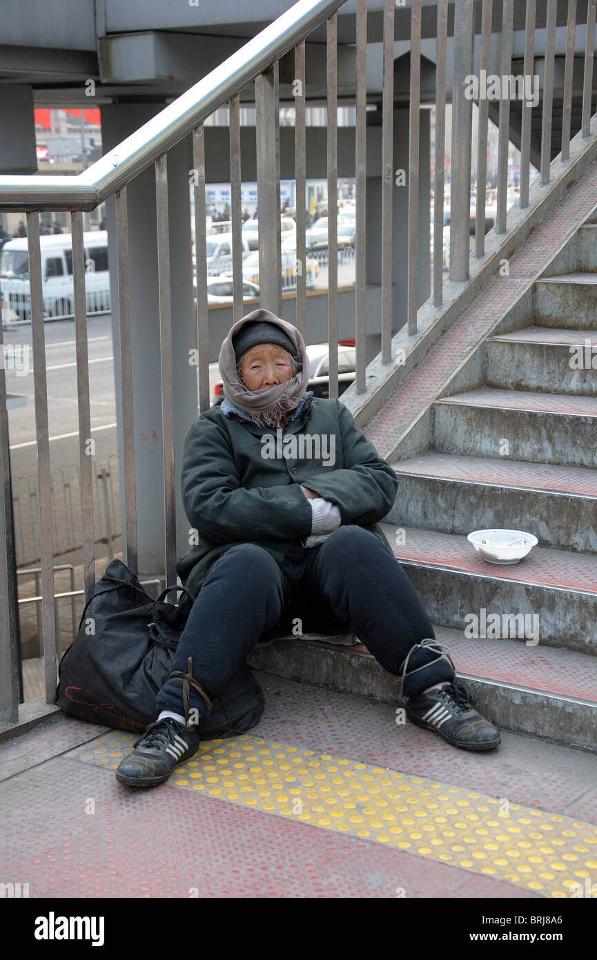Beggar in train hi-res stock photography and images - Alamy