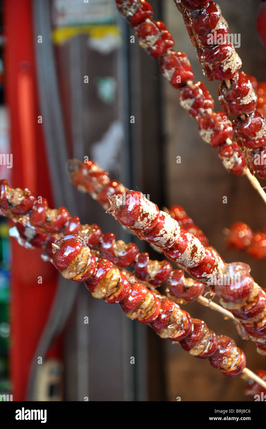Candied Apples on a stick at food market in Beijing in China Stock ...