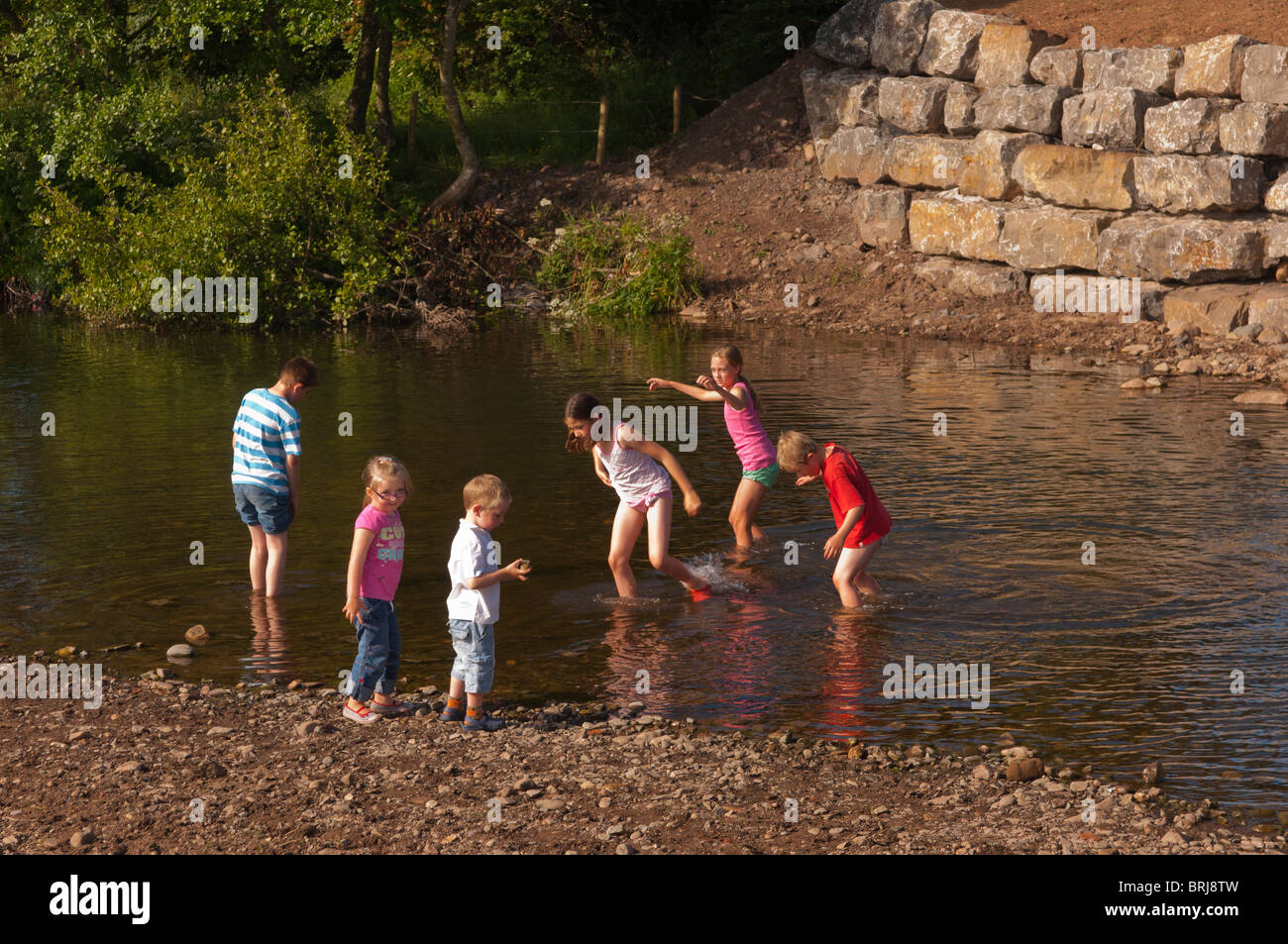 Boys playing in river hi-res stock photography and images - Alamy