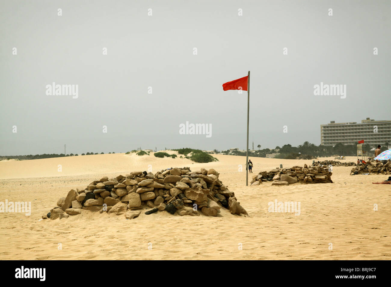 Red warning flag on beach Stock Photo - Alamy