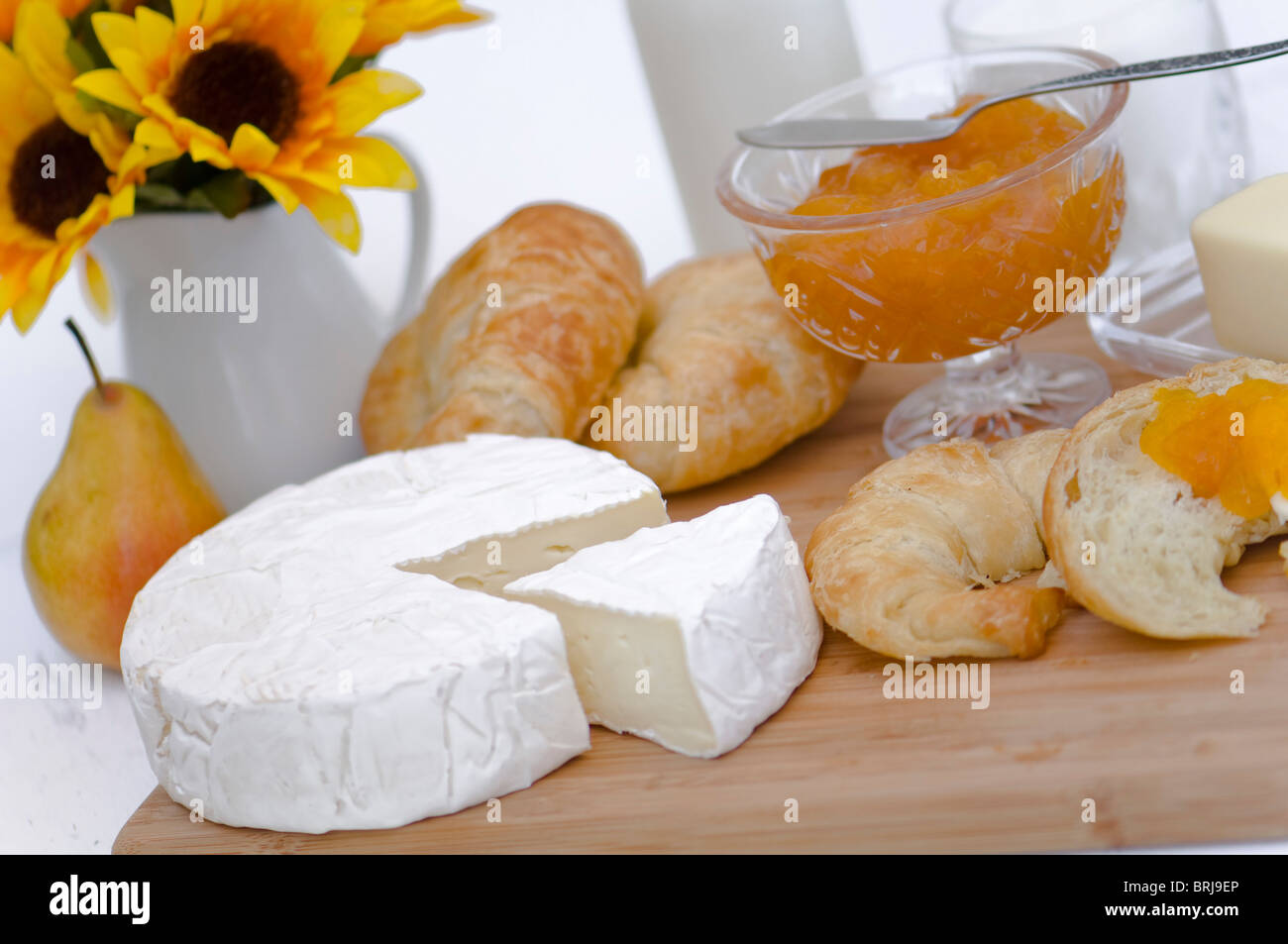 Breakfast with croissant, Camembert cheese, milk, and apricot jam Stock ...