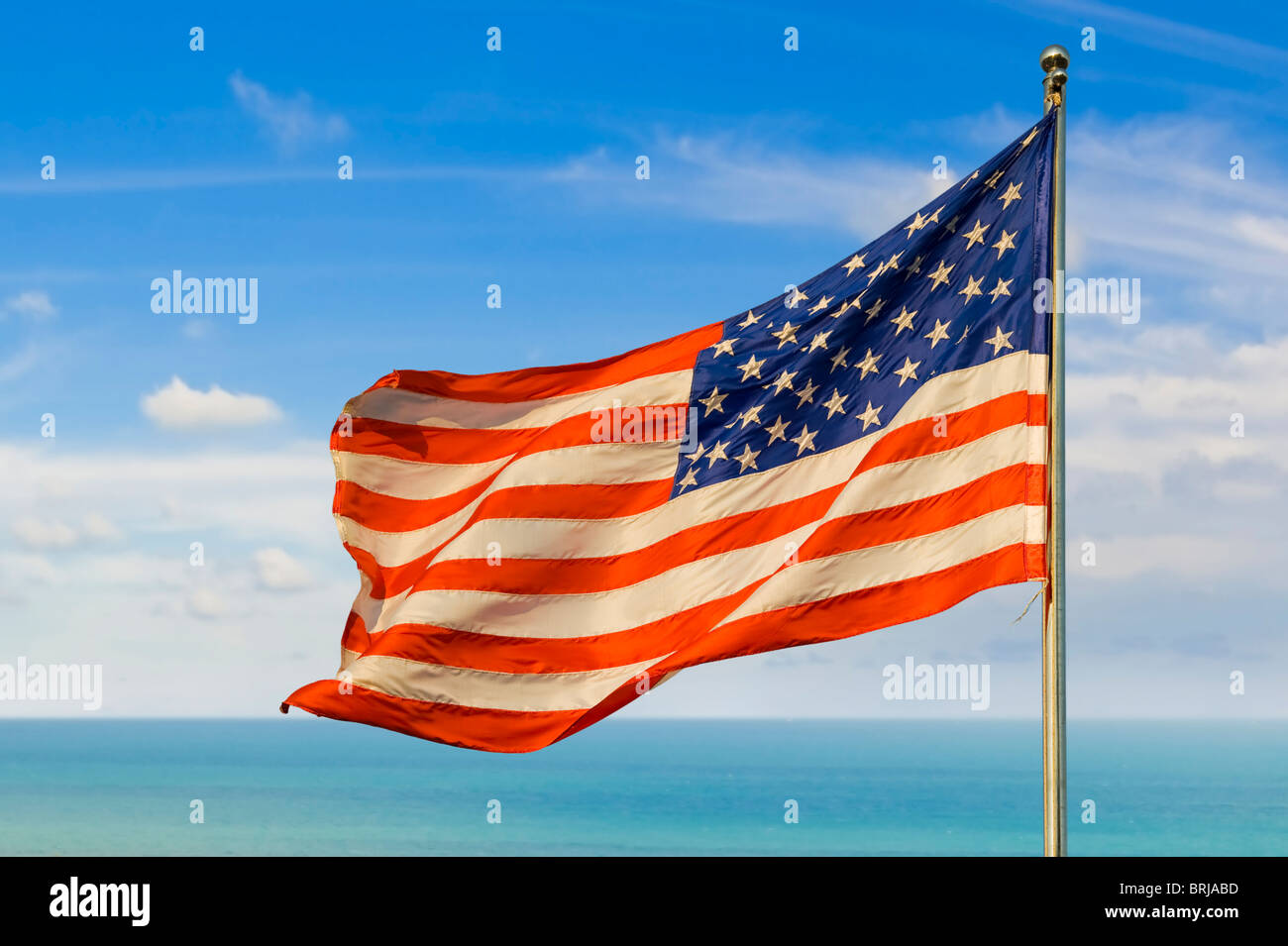 us flag against horizon over water Stock Photo - Alamy