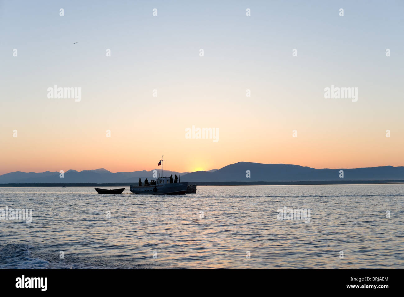 fishermen on two boats go to morning fishing Stock Photo - Alamy