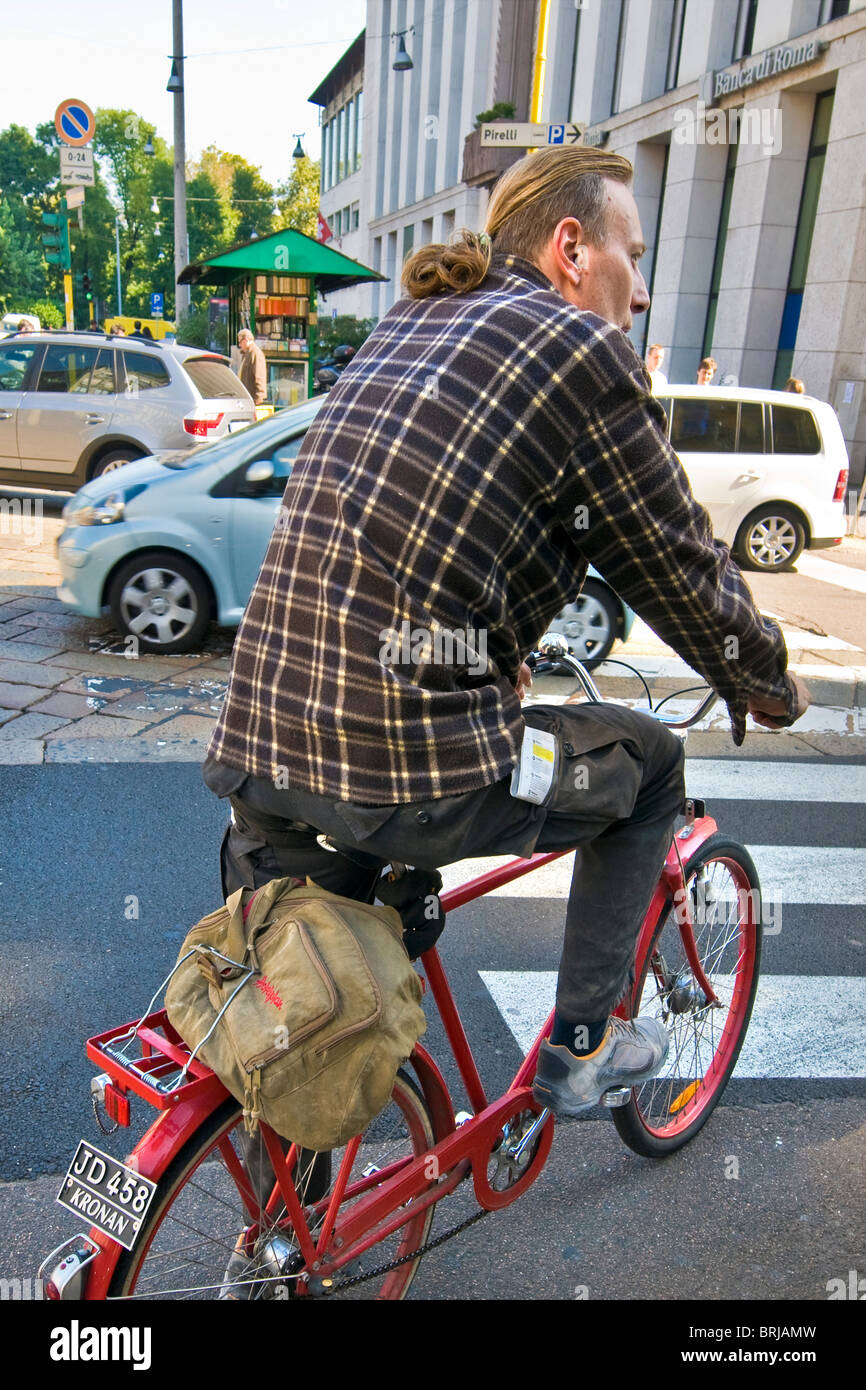Cyclist in city center, Milan, Italy Stock Photo - Alamy