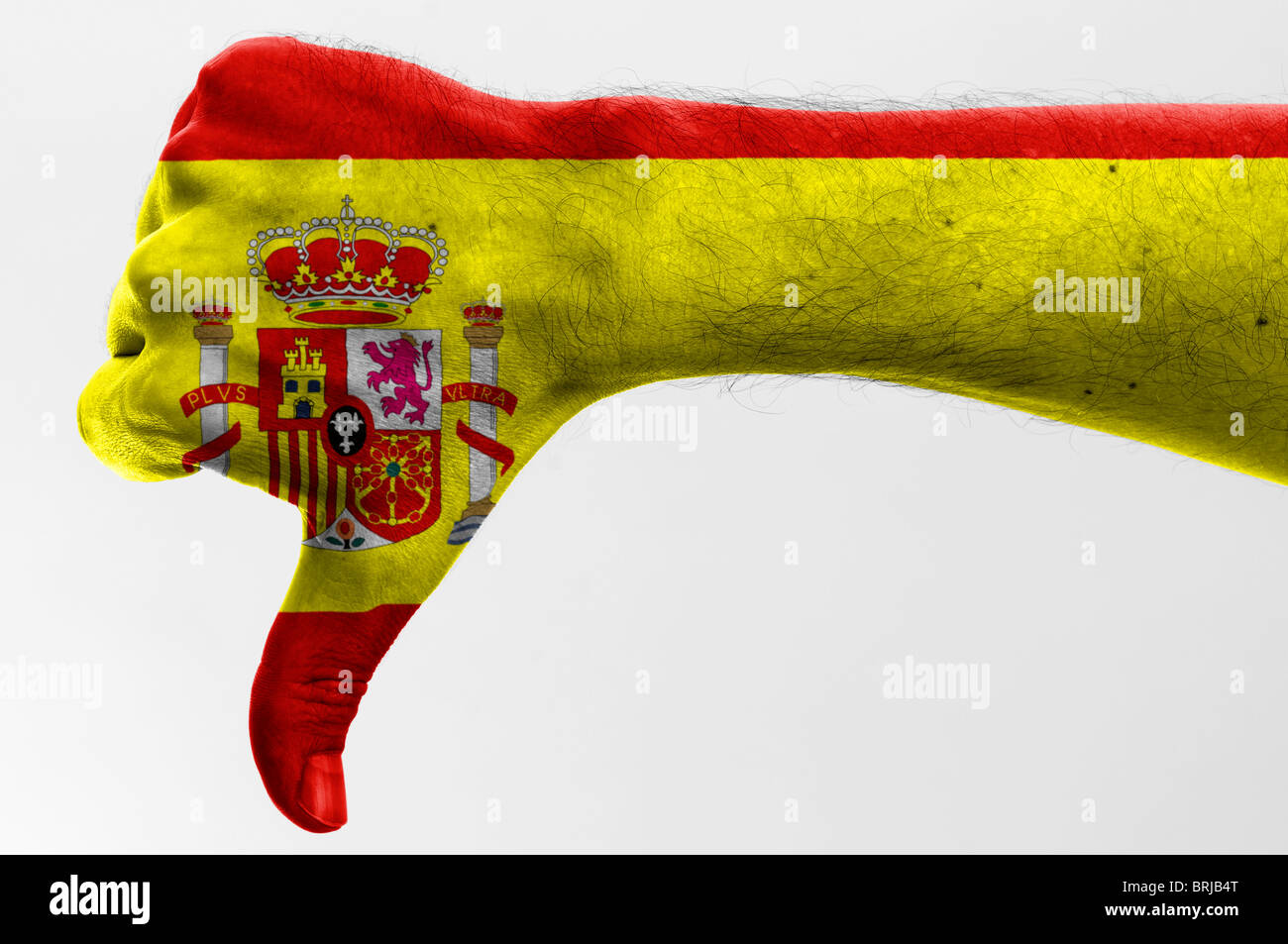thumb down with digitally body-painted spanish flag Stock Photo - Alamy