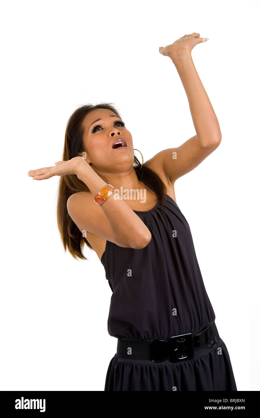 shocked woman sees something falling down on her, isolated on white ...