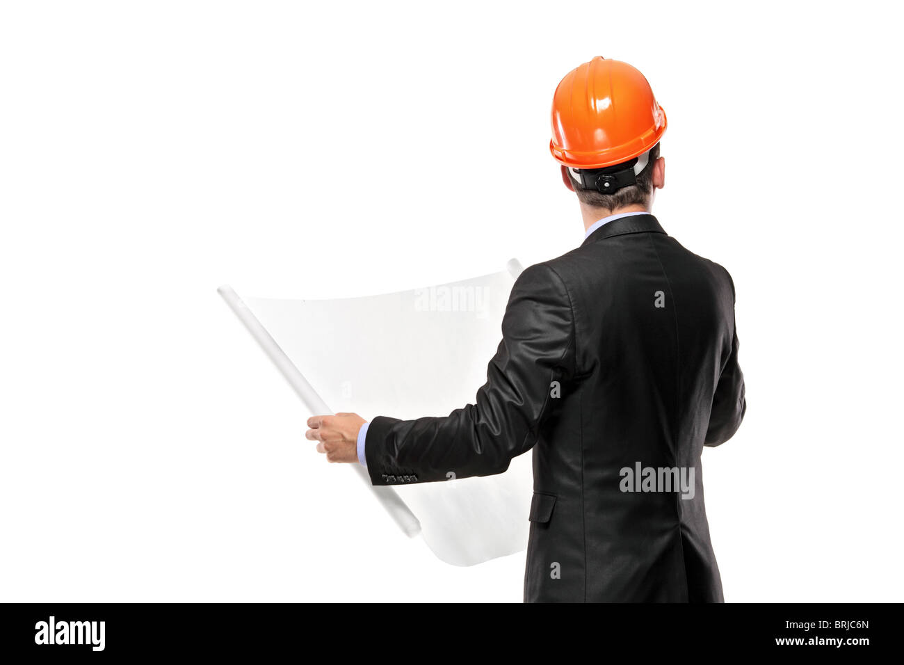 Male architect looking at blueprints Stock Photo - Alamy