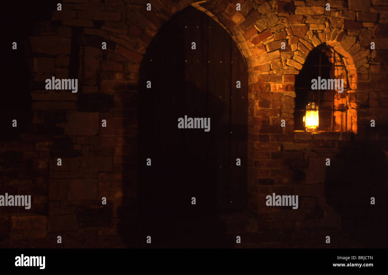 Oil lamp in window Stock Photo - Alamy