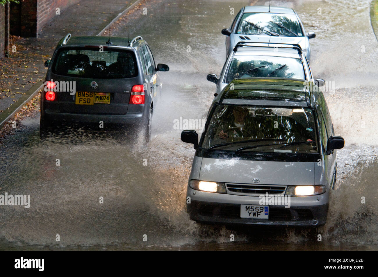 Driving through flood water Stock Photo - Alamy
