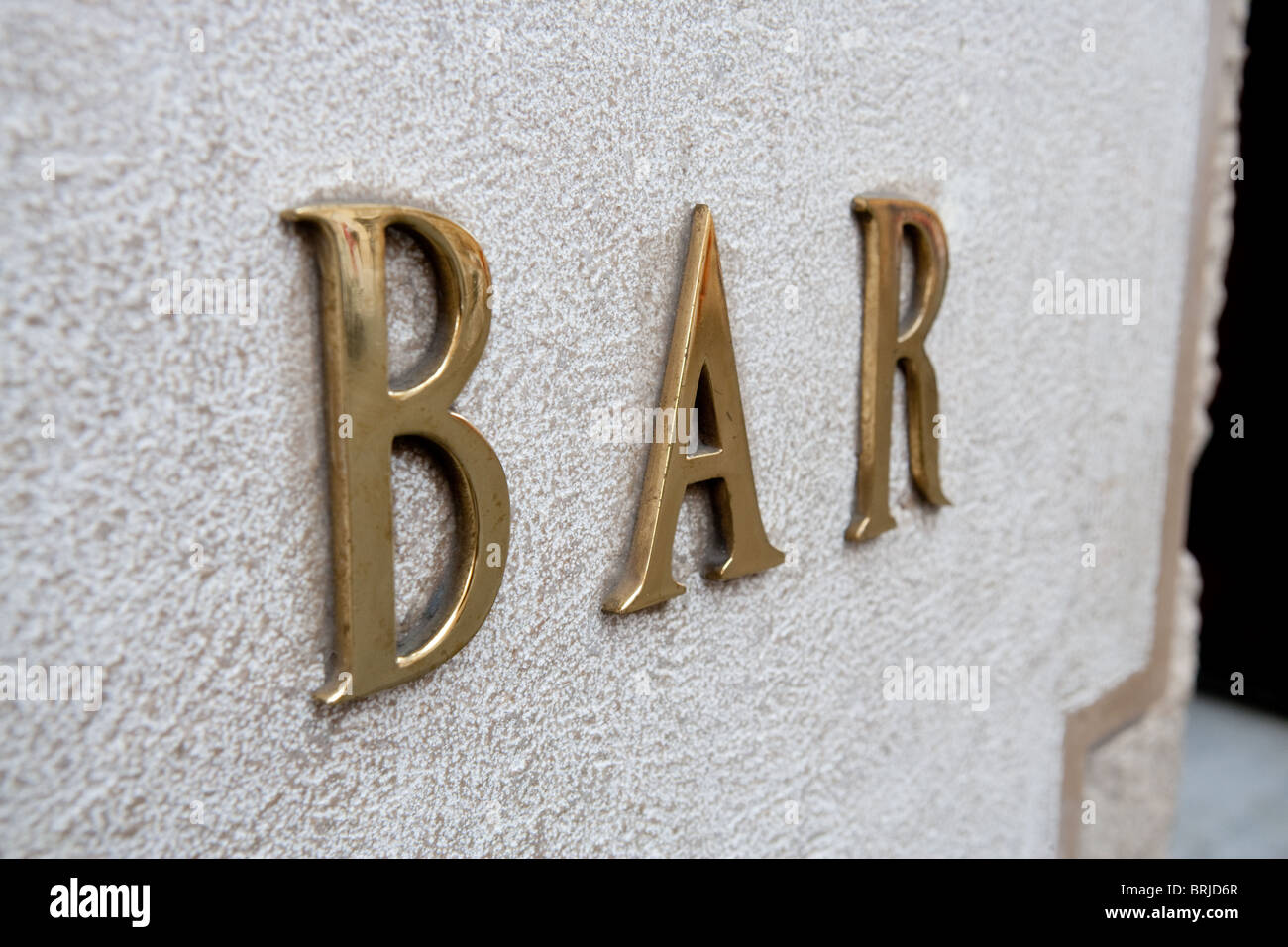 Bar written sign characters gold types wall mark Stock Photo - Alamy