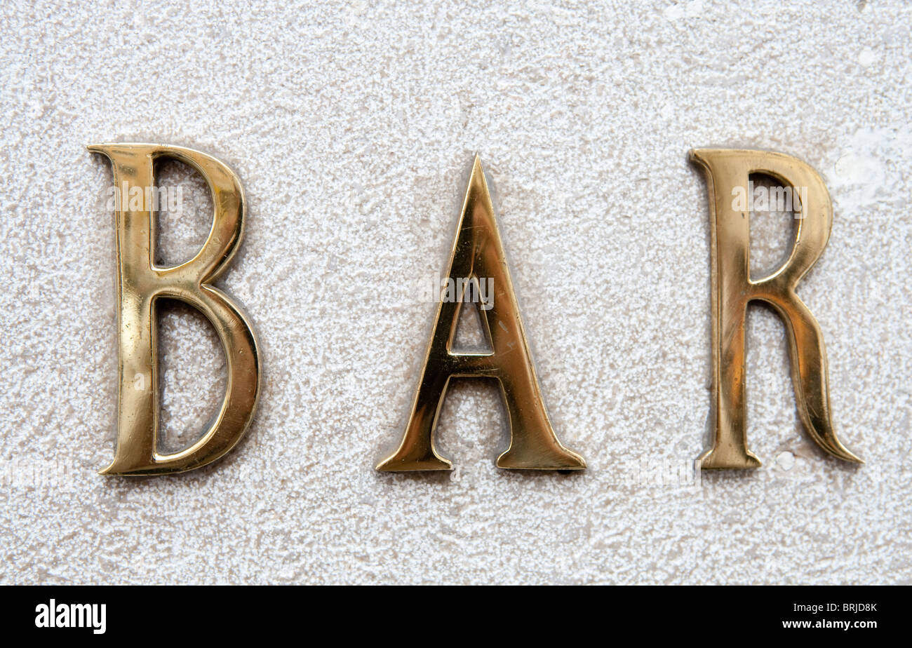 Bar written sign characters gold types wall mark Stock Photo - Alamy