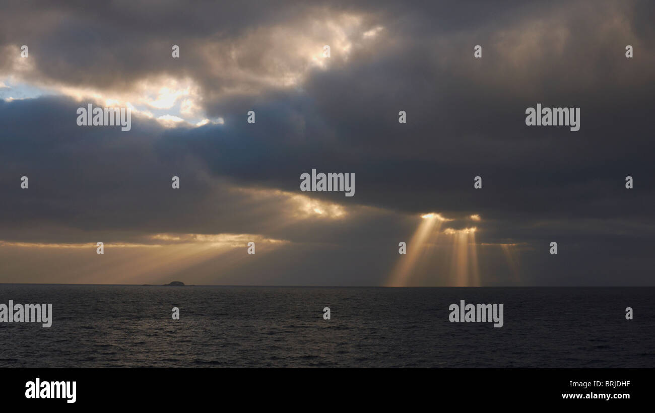 Light shafts at sunset over the Outer Hebrides from the Isle of Skye ...