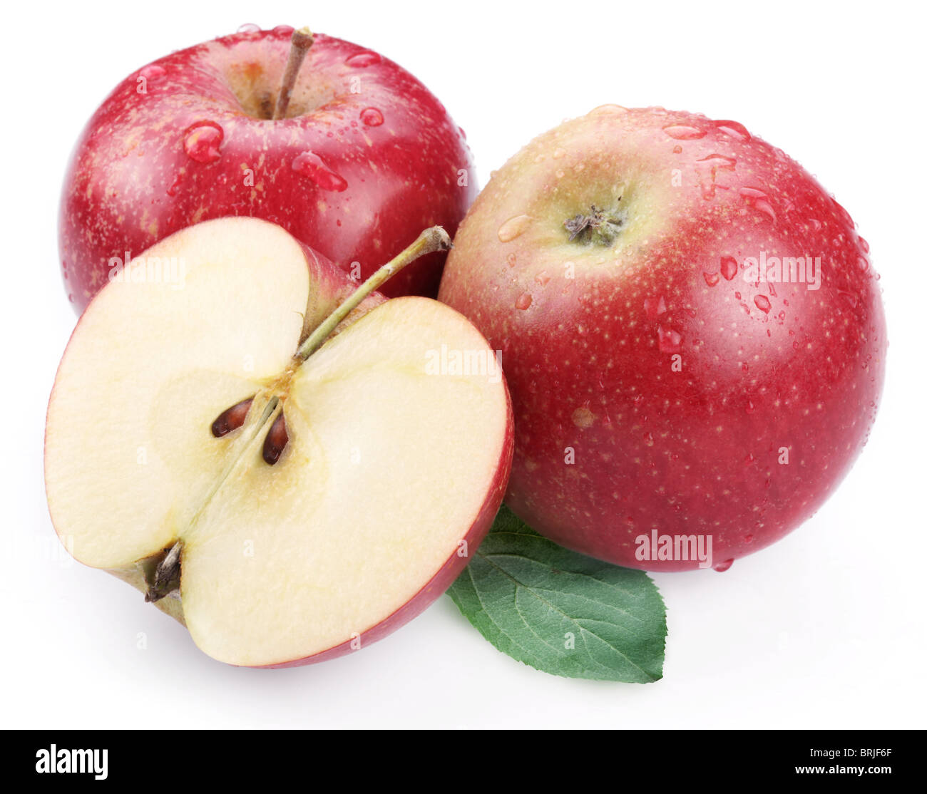 Two red apple with leaf and half of apple isolated on a white ...