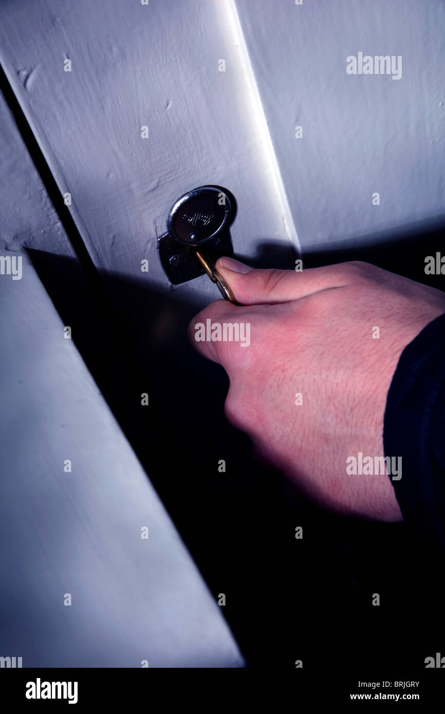 Man and hands locking door hi-res stock photography and images - Alamy