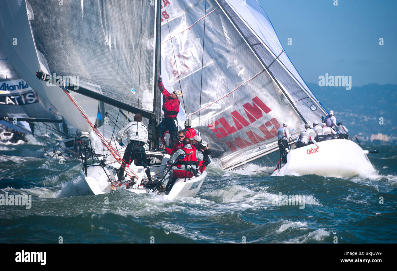 shakedown's mast man raising the spinnaker around the upwind mark Stock ...