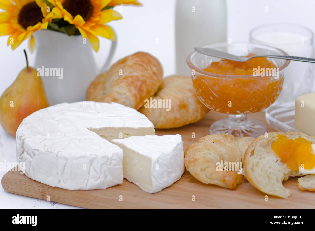 Breakfast with croissant, Camembert cheese, milk, and apricot jam Stock ...