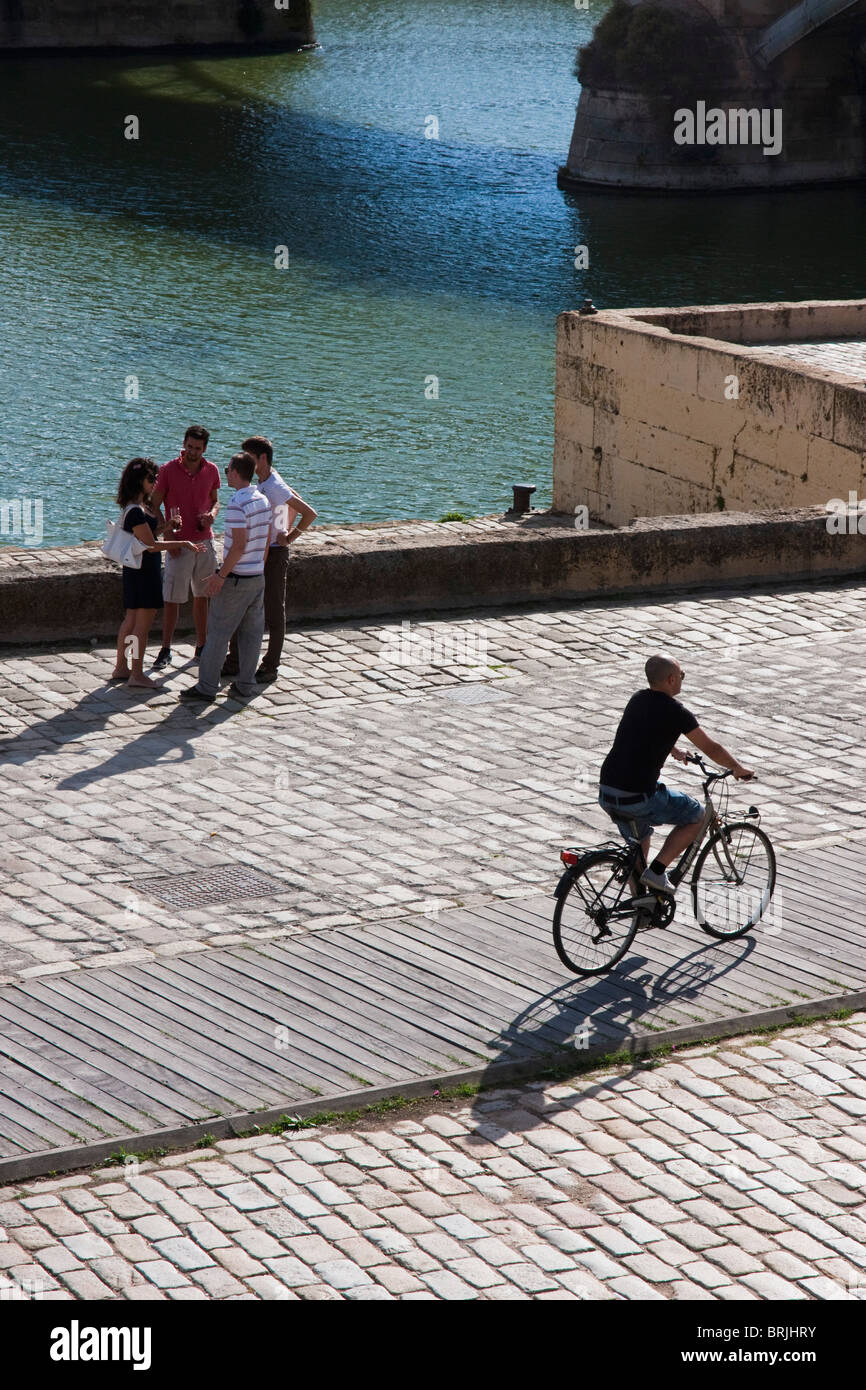people on the river front in sevilla, spain Stock Photo - Alamy