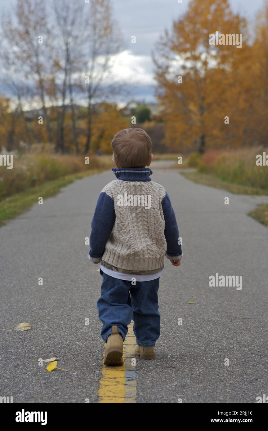 Child walking down path Stock Photo - Alamy