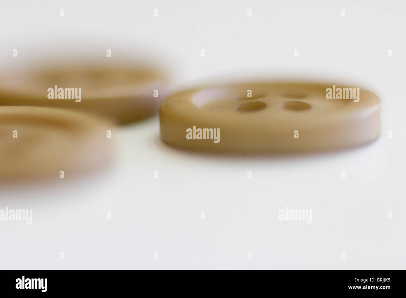 Brown Shirt Buttons Stock Photo - Alamy