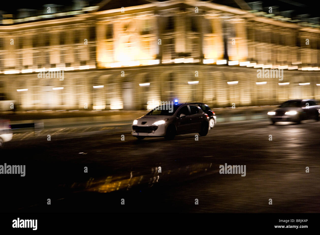 Emergency medical car driving at night Stock Photo - Alamy