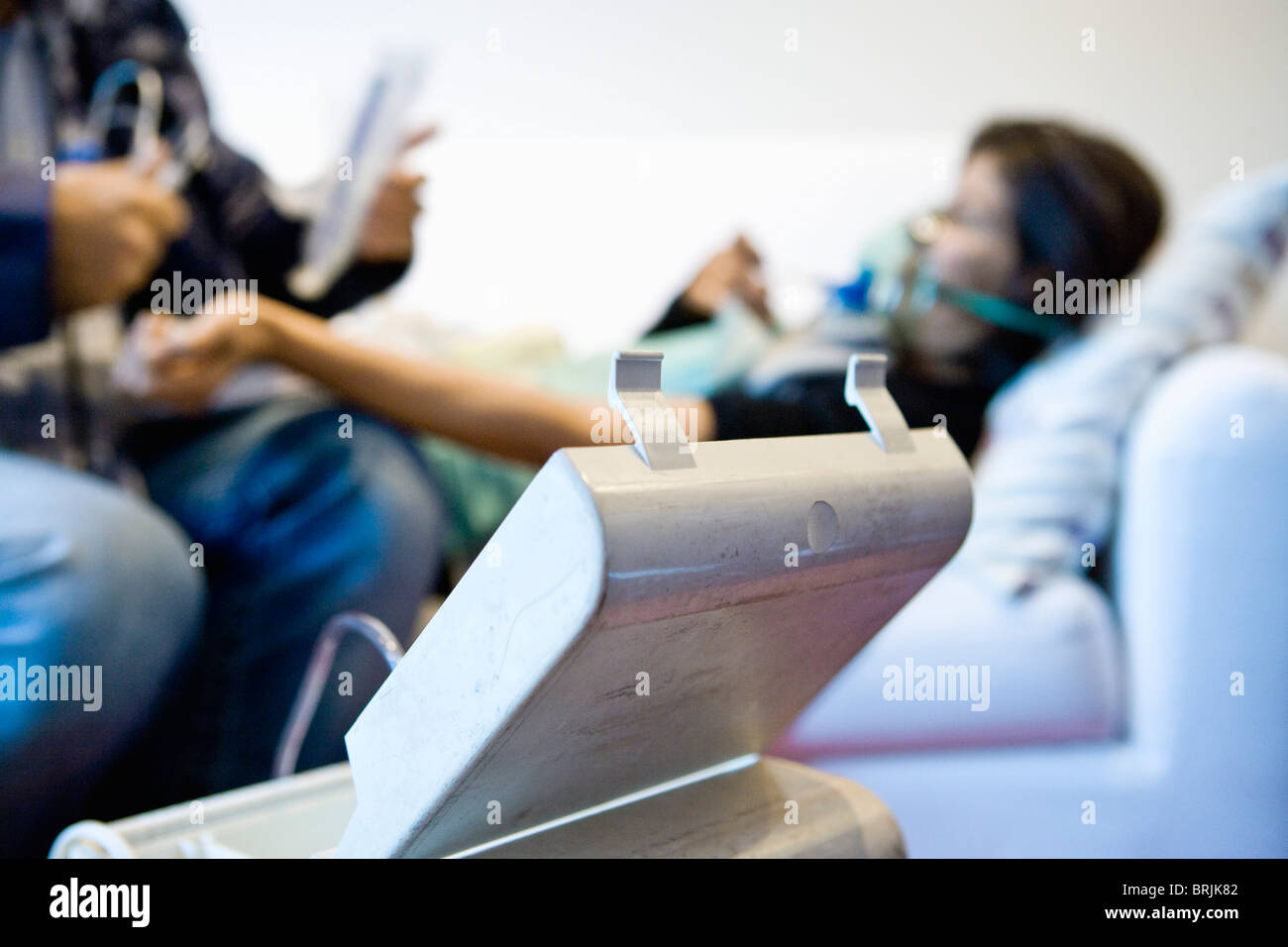 Doctor treating patient in home Stock Photo - Alamy