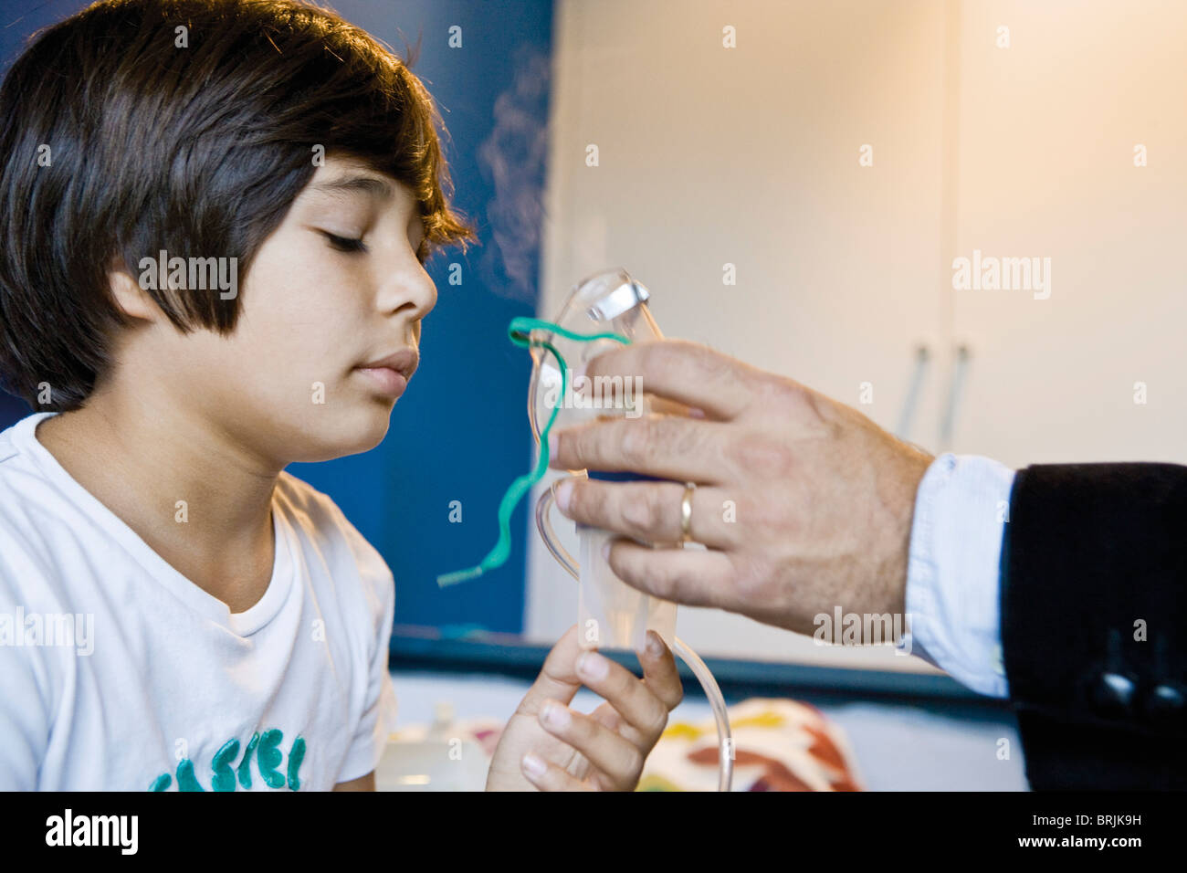 Boy receiving oxygen treatment Stock Photo - Alamy