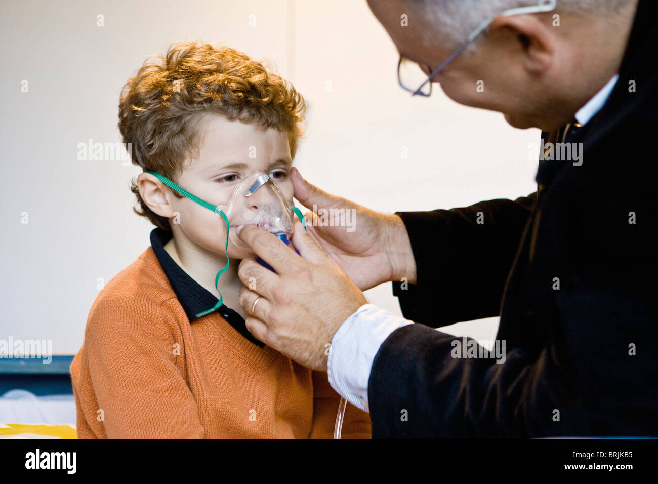 Boy receiving oxygen treatment Stock Photo - Alamy
