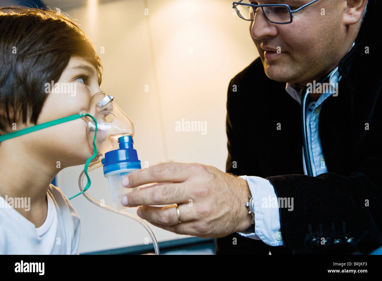 Boy receiving oxygen treatment Stock Photo - Alamy