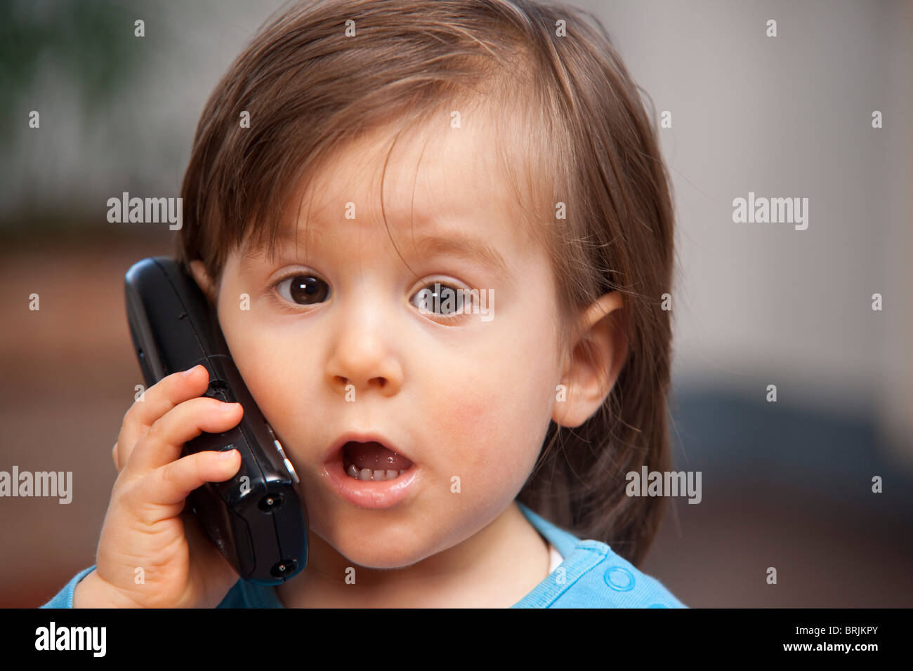 Little Boy Using Cell Phone Stock Photo - Alamy