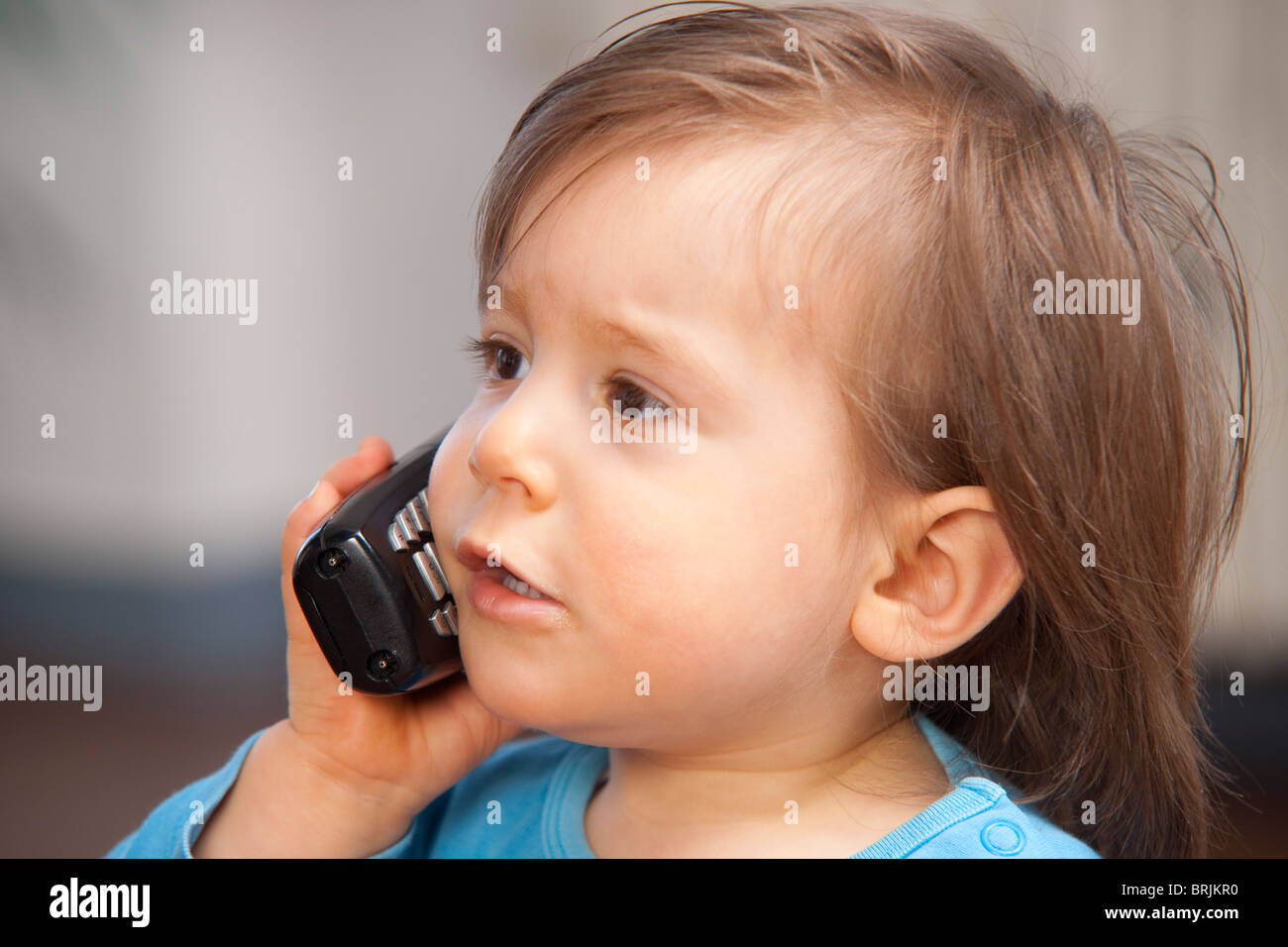 Boy Talking on Cell Phone Stock Photo - Alamy