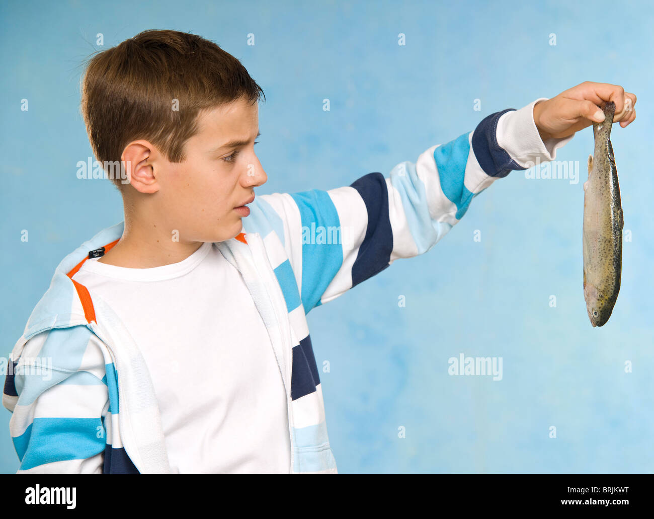Boy Holding Dead Fish Stock Photo - Alamy