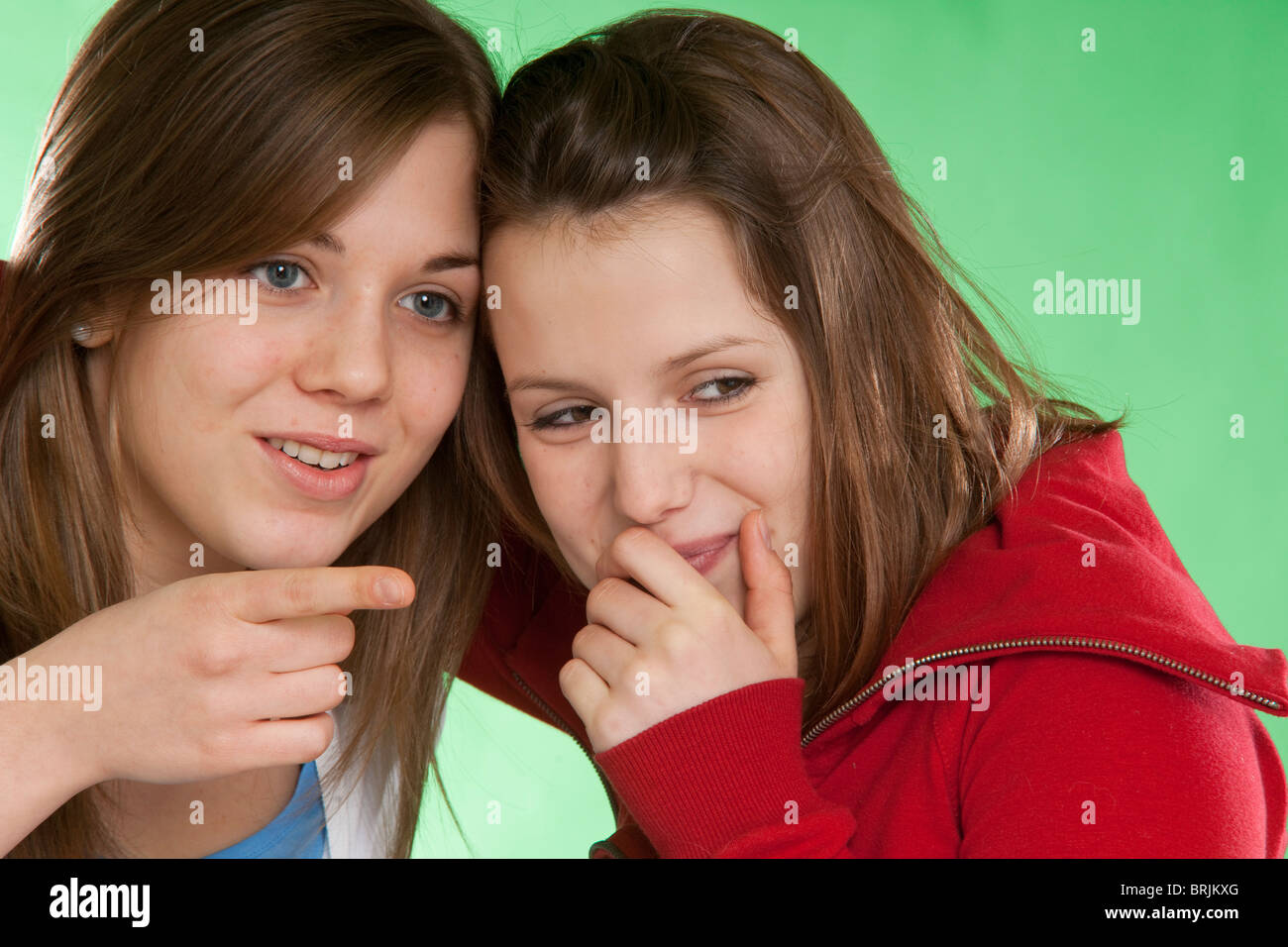 Two Friends Telling a Secret Stock Photo - Alamy