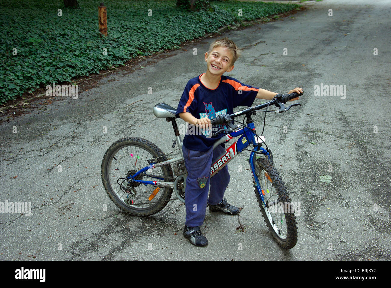 Boys ride bicycles Stock Photo - Alamy