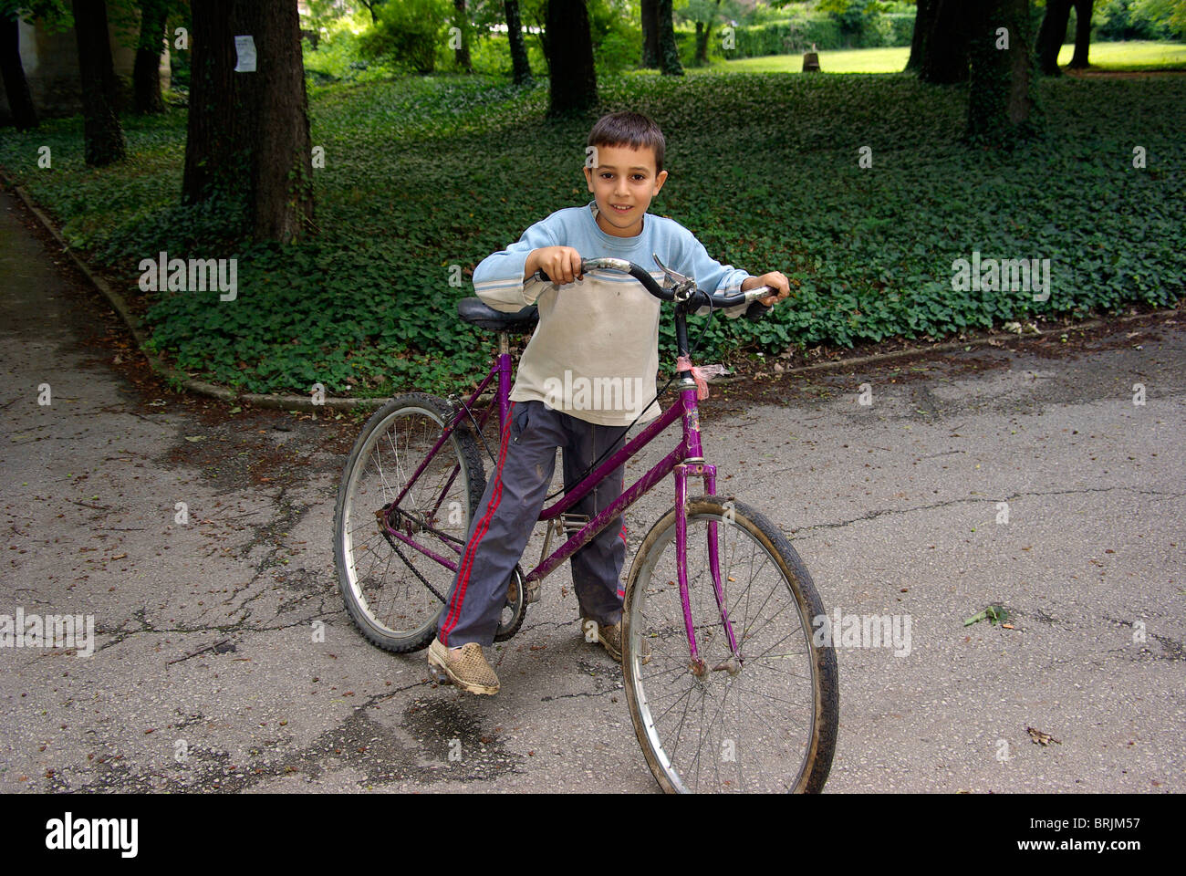 Boys ride bicycles Stock Photo - Alamy