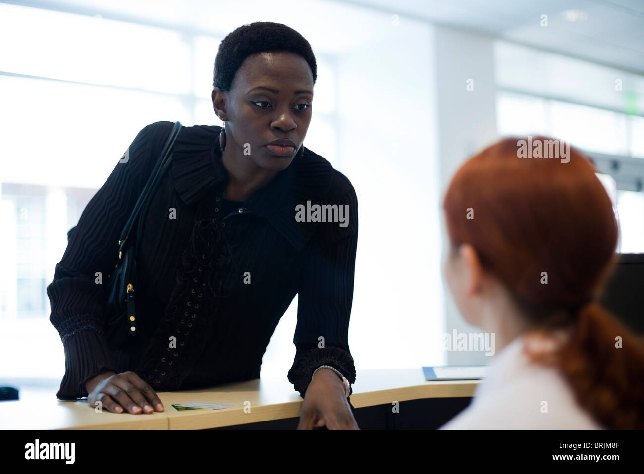 Office workers talking upset hi-res stock photography and images - Alamy