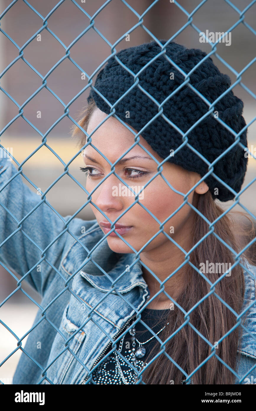 Portrait of Woman behind Fence Stock Photo - Alamy