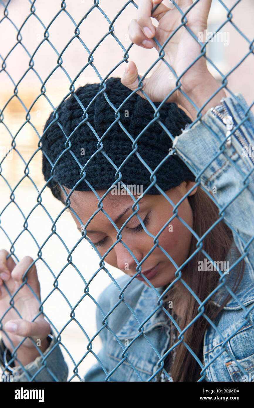 Portrait of Woman behind Fence Stock Photo - Alamy