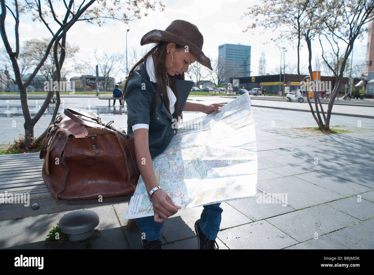 Woman Looking at Map Stock Photo - Alamy