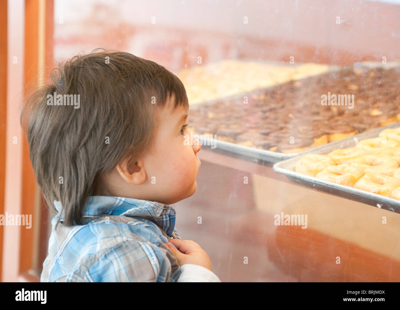 Boy Looking in Bakery Window Stock Photo - Alamy