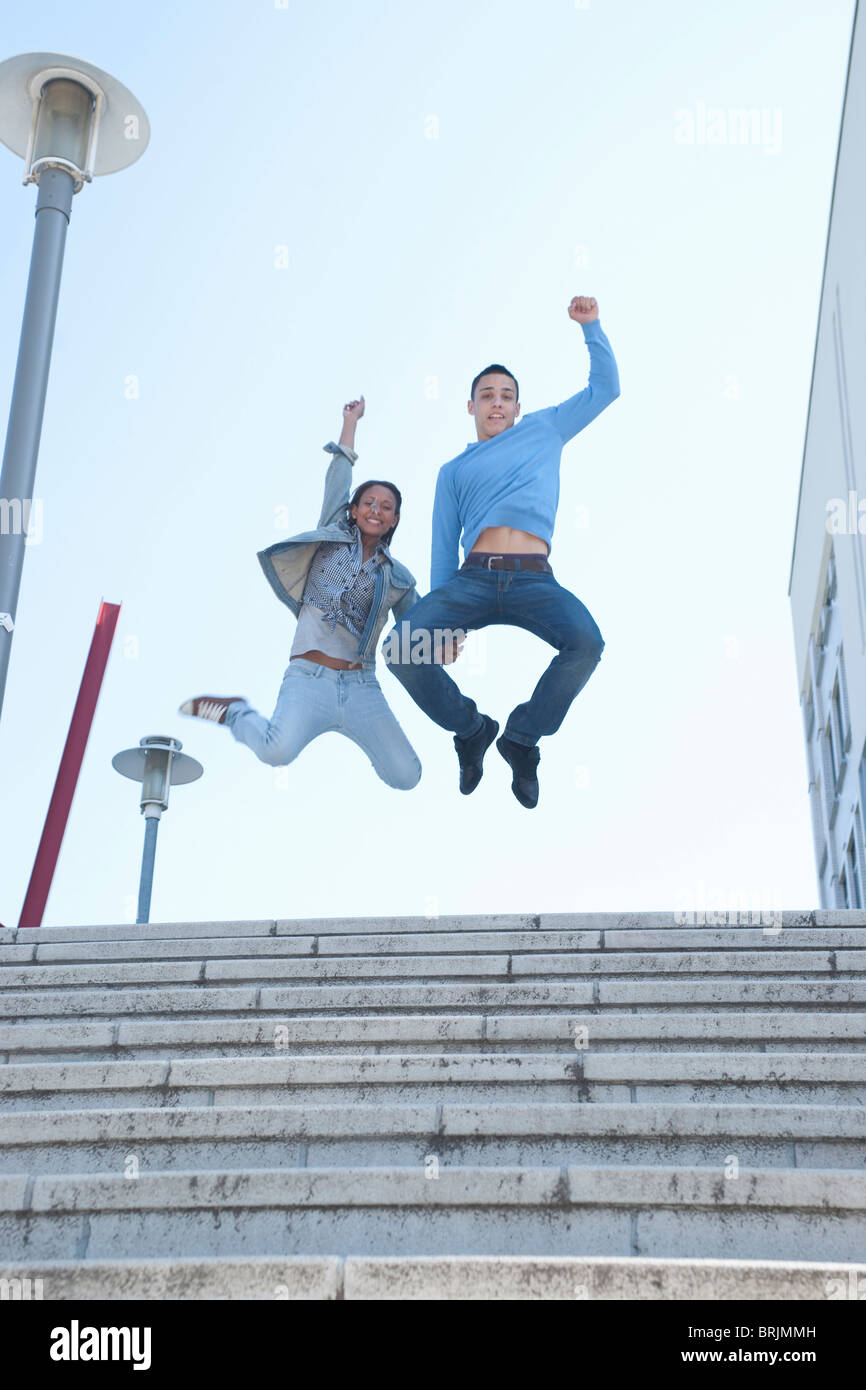 Couple Jumping in Air Stock Photo - Alamy